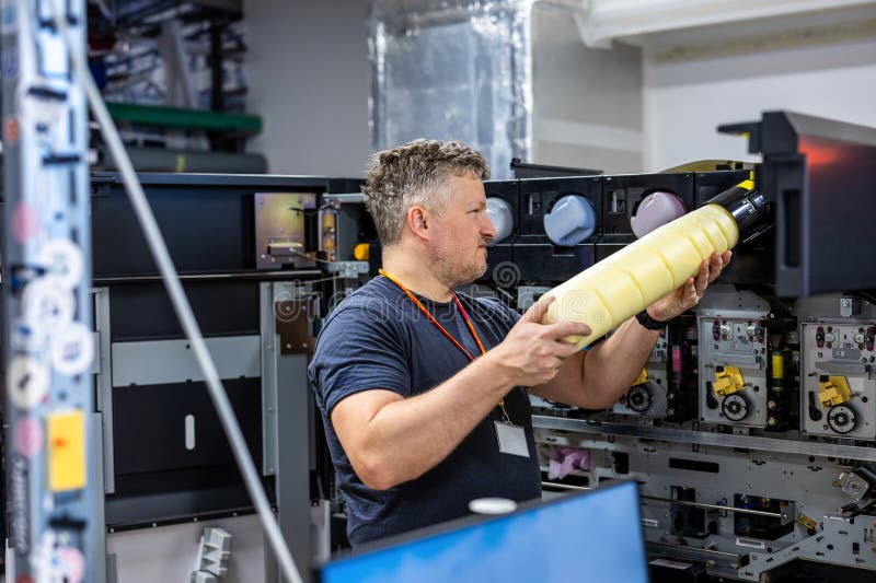 Maintenance Engineer in a in Printing House Fixing Machine Stock Photo ...