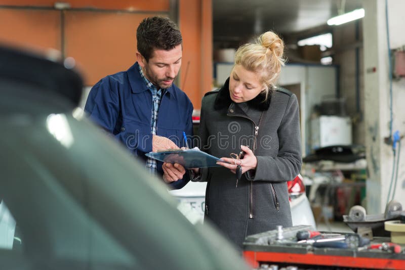 Maintenance Engineer with Female Customer in Car Repair Stock Image ...