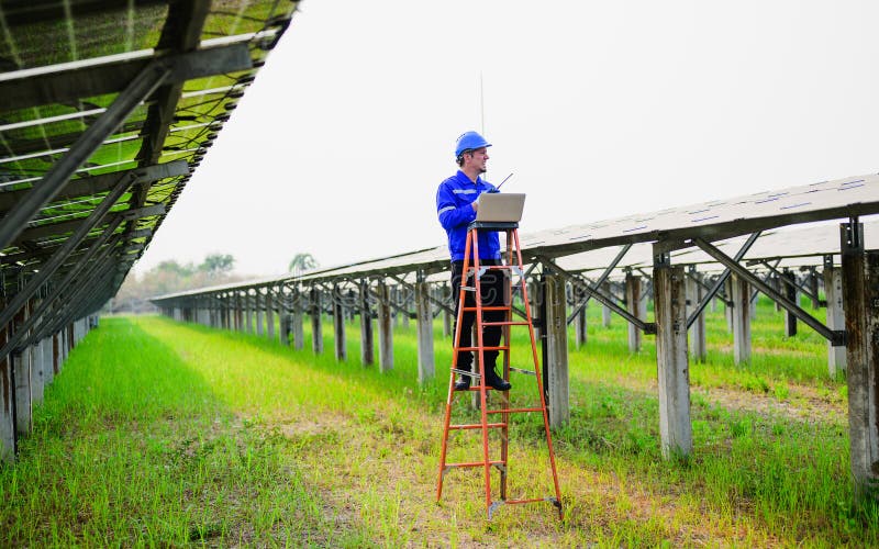 Maintenance Engineer Maintaining Solar Panels on Solar Cell Farm Stock ...