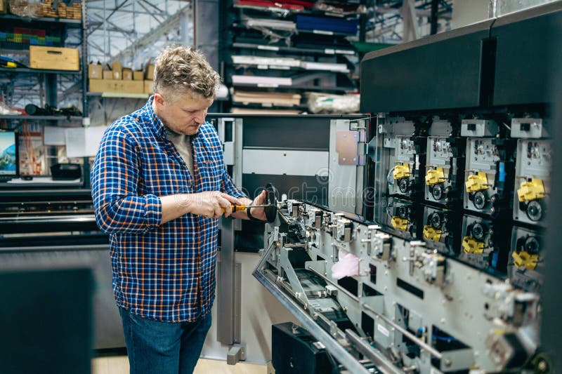 Maintenance Engineer in a in Printing House Fixing Machine Stock Photo ...