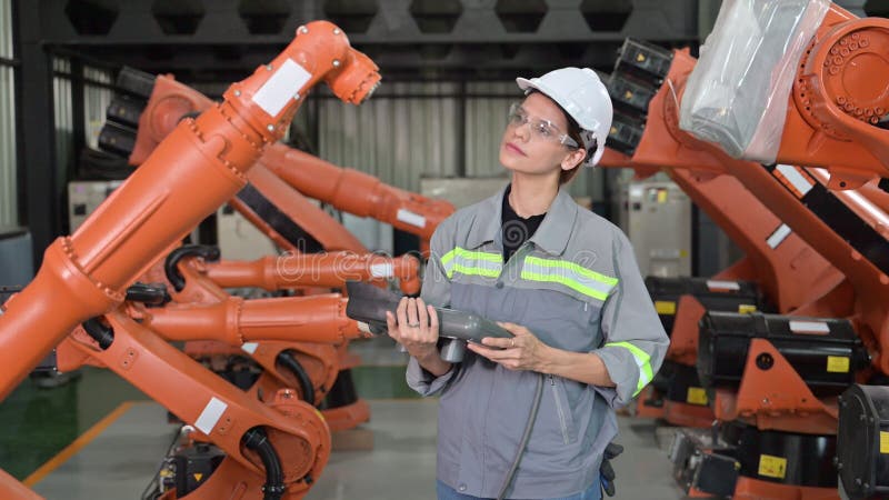 Maintenance Engineer Worker Working with Robotic Machine at Factory ...