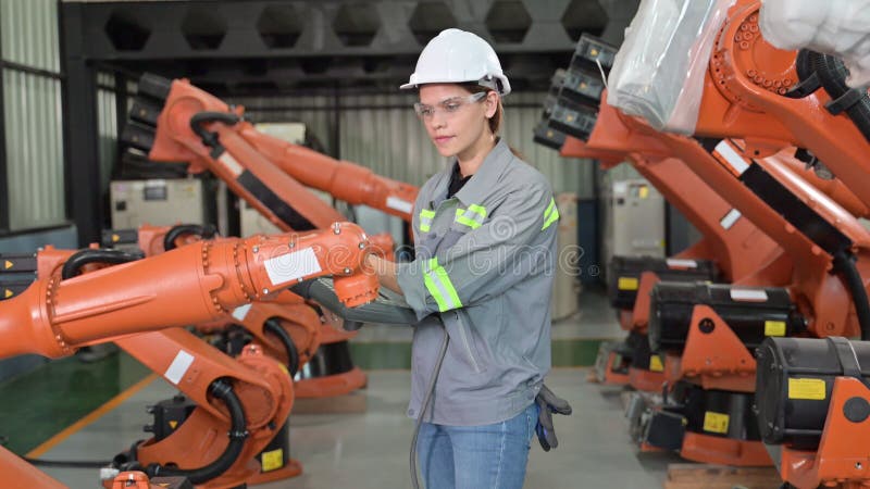 Maintenance Engineer Worker Working with Robotic Machine at Factory ...