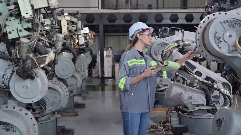 Maintenance Engineer Worker Working with Robotic Machine at Factory ...