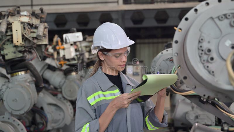 Maintenance Engineer Worker Working with Robotic Machine at Factory ...