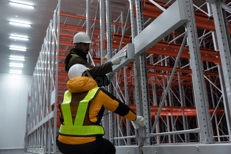 Maintenance Engineering Checking Moving Rack System in Warehouse ...