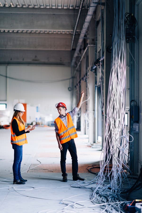 Maintenance Engineers Checking Cables on Construction Site Stock Image ...