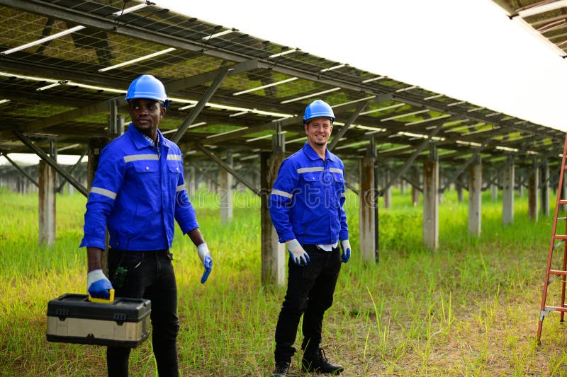 Maintenance Engineers Installing Solar Panels on Solar Cell Farm Stock ...