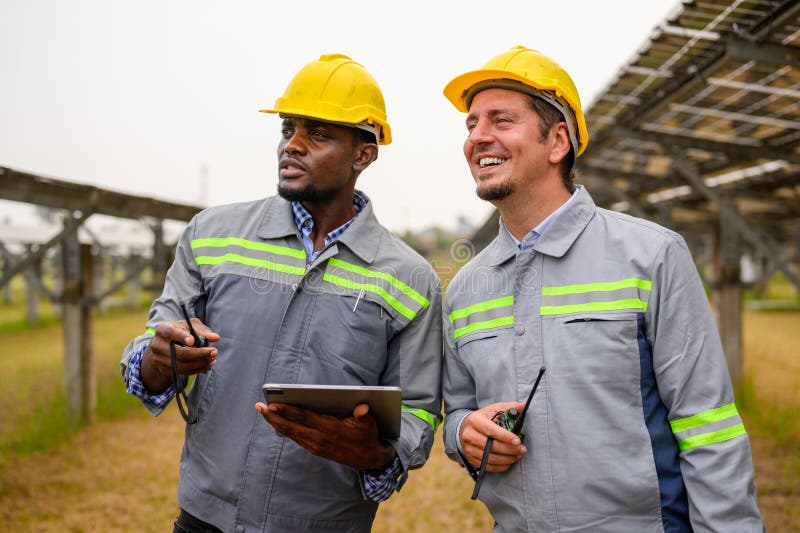 Maintenance Engineers Team Checking Solar Panels on Solar Cell Farm ...