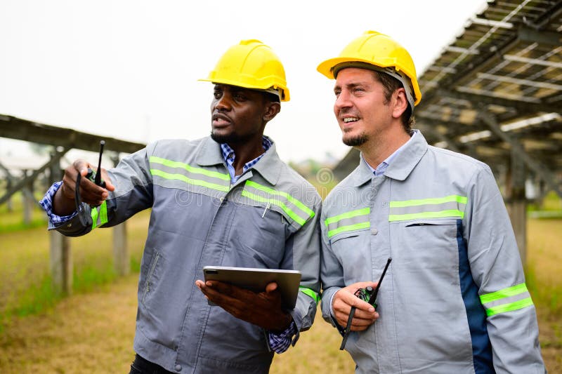 Engineer Team Checking and Maintaining Solar Panels on Solar Power ...