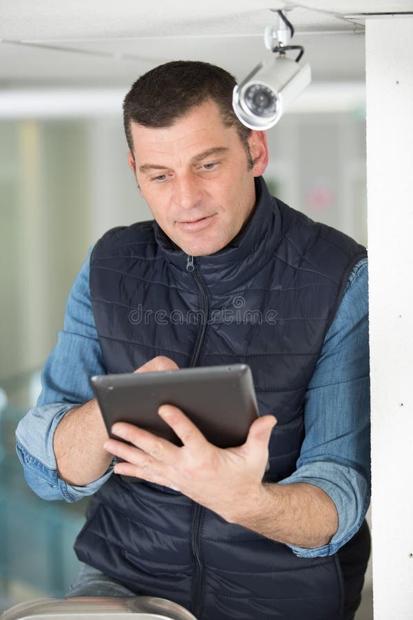 Maintenance Man by Cctv Camera Holding Tablet Stock Image - Image of ...