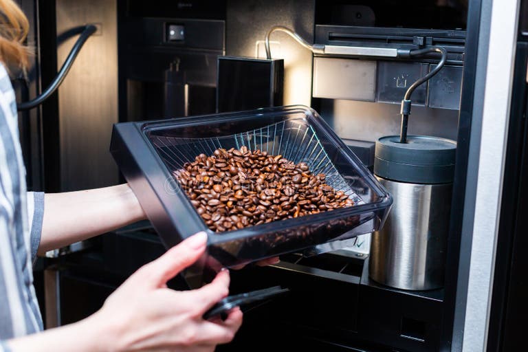 Maintenance of Modern Coffee Machines. Loading Coffee Beans. Stock ...
