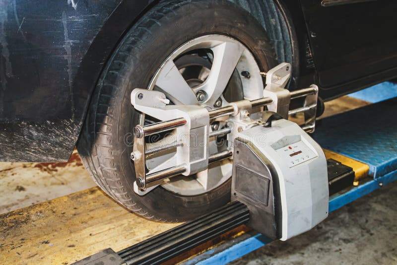 Car Wheel Fixed with Computerized Wheel Alignment Machine in a ...