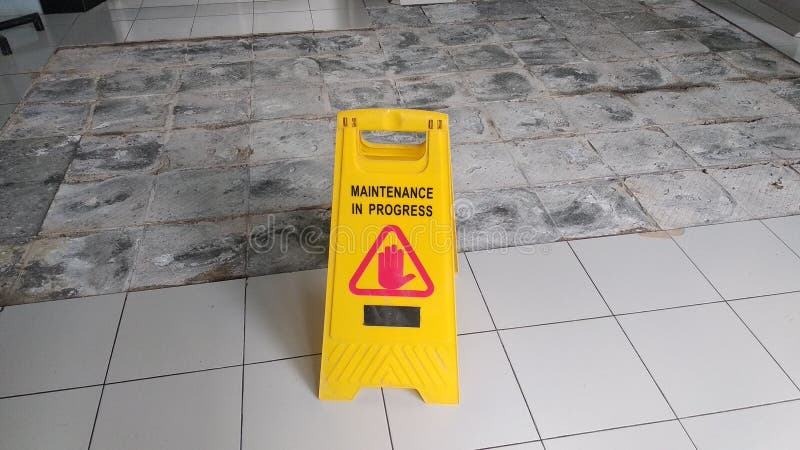 "Maintenance in Progress" Sign in the Floor Stock Photo - Image of slip ...