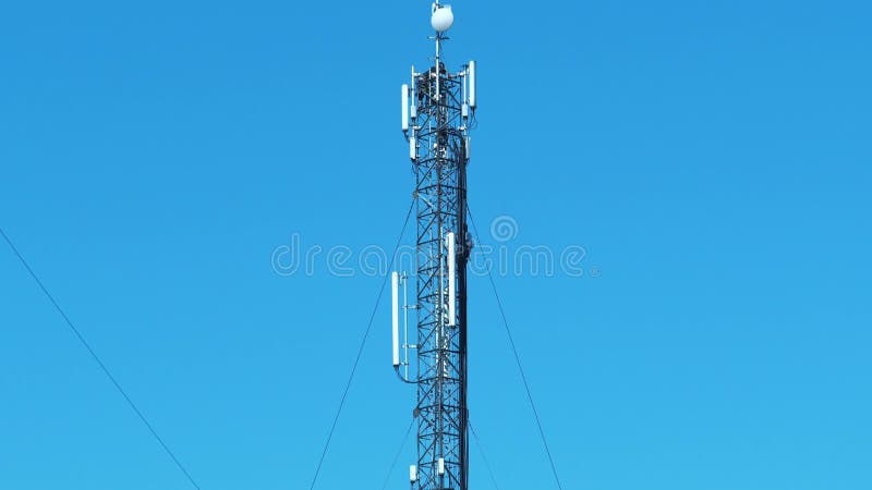Two Workmen on a Cell Tower. Maintenance Staff at the Work. High ...