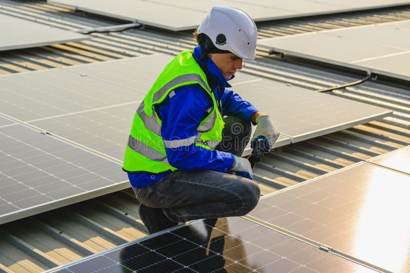 Maintenance Technicians Installing Solar Panels at Solar Cell Farm ...
