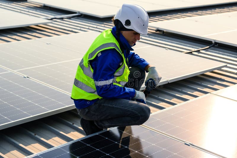 Maintenance Technicians Installing Solar Panels at Solar Cell Farm ...