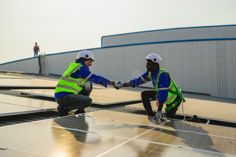 Maintenance Technicians Installing Solar Panels at Solar Cell Farm ...