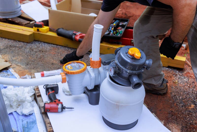 Maintenance Worker Installing Swimming Pool Cleaning Equipment a Sand ...