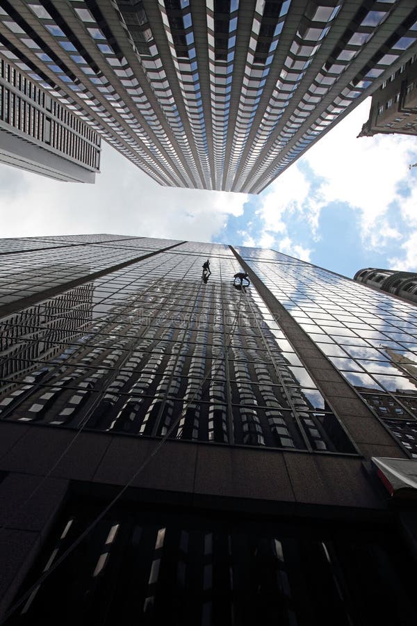 Maintenance Workers Climbing Outside a Skyscraper Stock Photo - Image ...