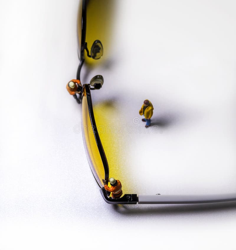 Maintenance Workers on a Spectacle Frame with Yellow Glasses Stock ...