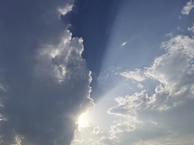 Majestic Dramatic Cloud Formation with Sunlight Breaking through, Creating Stunning Atmospheric ...
