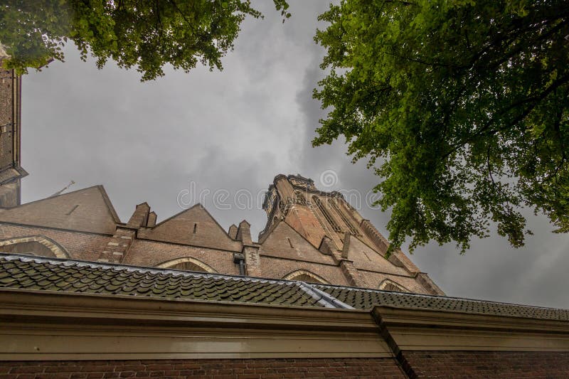 A Majestic Gothic Church Under a Dramatic Cloudy Sky. the Intricate ...