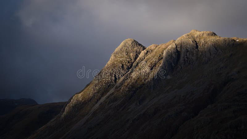 Majestic Mountain Range with a Backdrop of Cloudy Skies. Stock Image ...