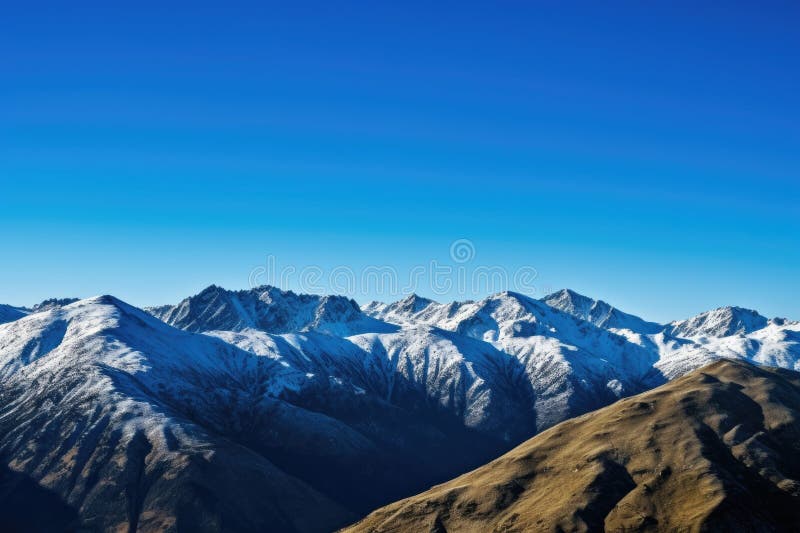 Majestic Mountain Range with a Clear Blue Sky Overhead Stock Photo ...