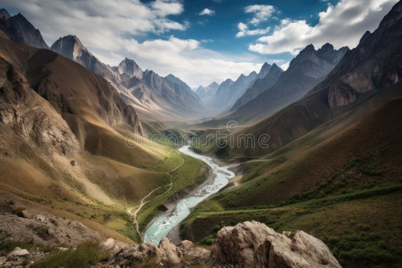 Majestic Mountain Range with a Hidden Valley and Flowing River Stock ...