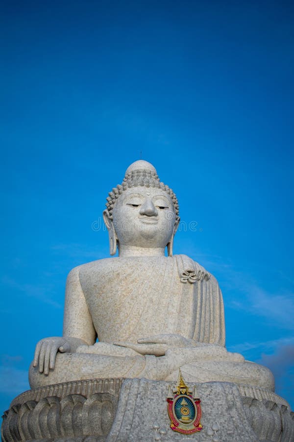 Majestic Statue of Buddha Against a Bright Blue Sky. Stock Photo ...