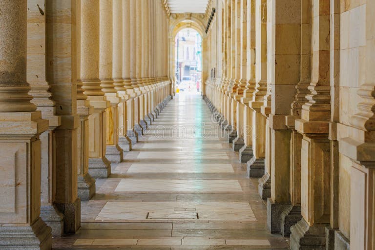 Majestic Stone Corridor with Columns and Arched Ceiling in Sunlight ...