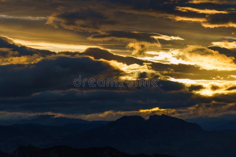 Majestic Sunset Over Mountain Range with Dramatic Clouds Stock Image ...
