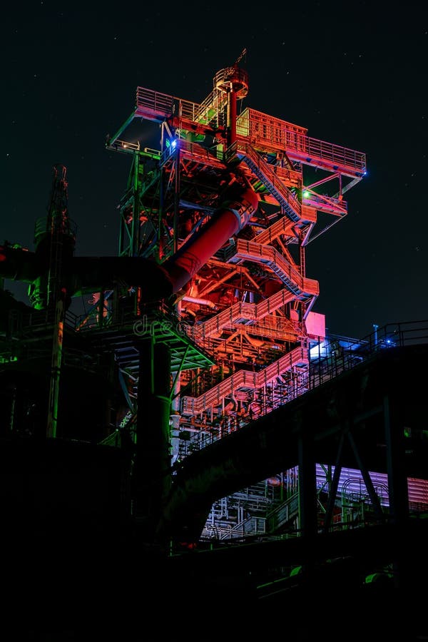 Majestic Tower Illuminated by Bright Lights Against a Star-studded ...