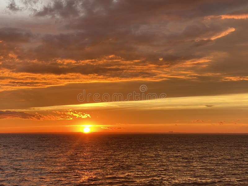 Majestic View of a Setting Down Sunset Sun with a Reflection on a Calm ...