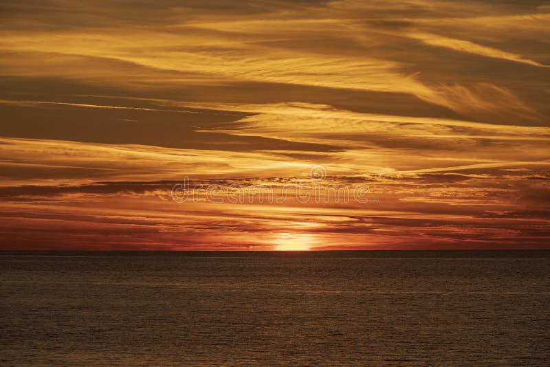 Majestic View of a Setting Down Sunset Sun with a Sea Water Surface ...