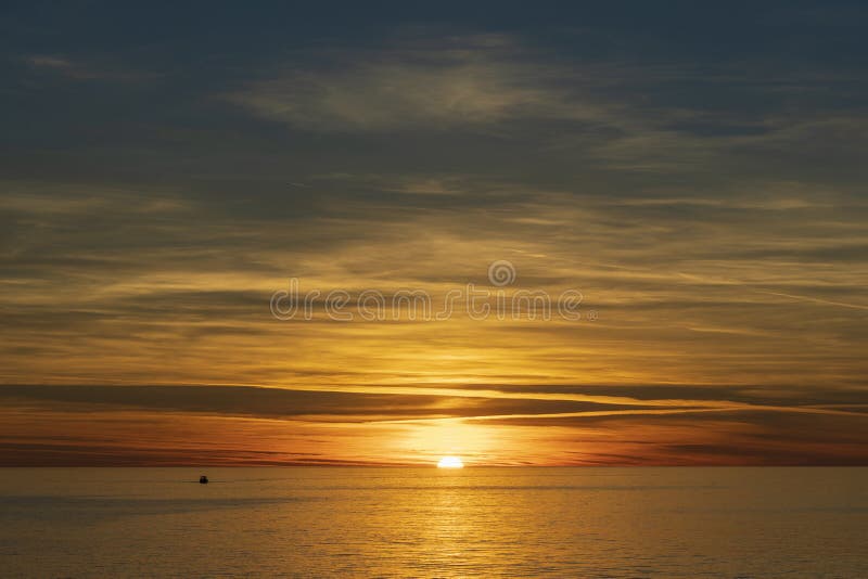 Majestic View of a Setting Down Sunset Sun with a Sea Water Surface ...