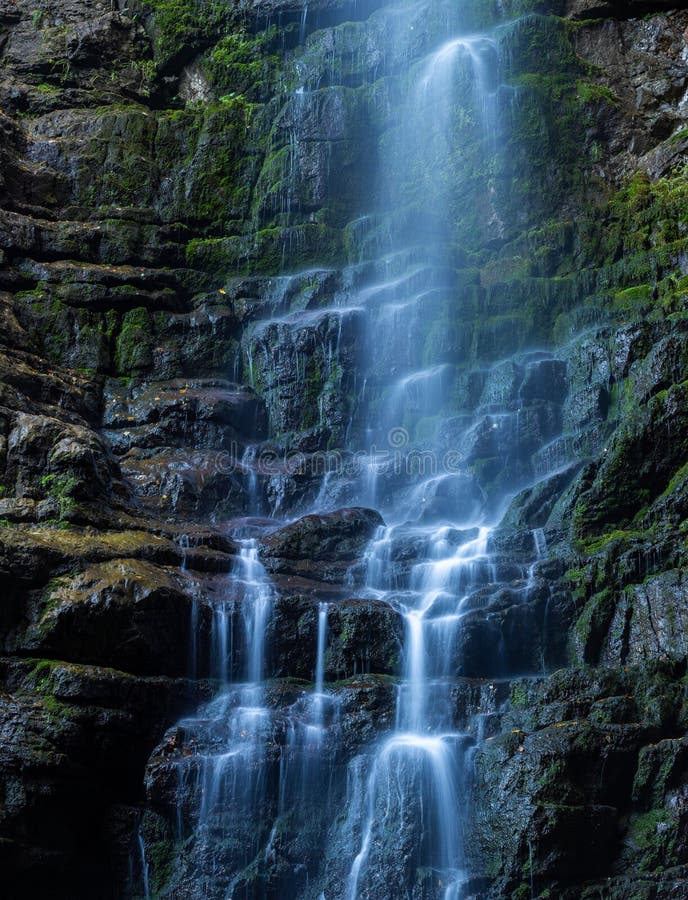 Majestic Waterfall Cascades Down a Cliff. Stock Image - Image of falls ...