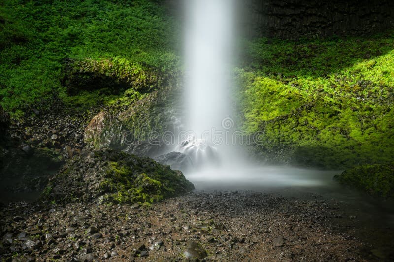 Majestic Waterfall Cascades Down the Side of a Lush Green Forest. Stock ...