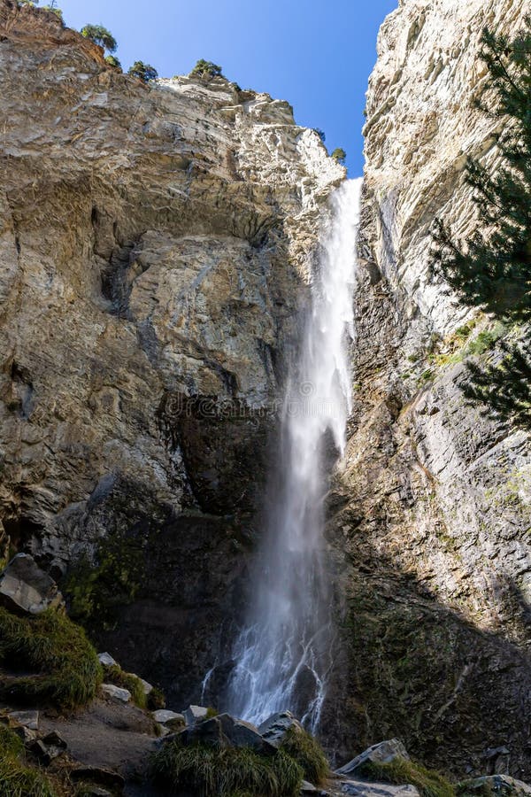 Majestic Waterfall Cascading Down Cliffs Stock Photo - Image of blue ...
