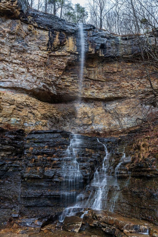 Majestic Waterfall Cascading Down a Sheer Rock Face into a Tranquil ...