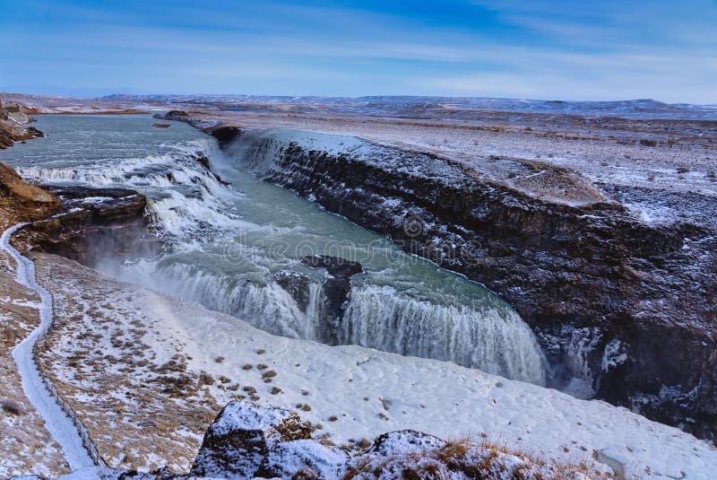 Majestic Waterfall Cascading Down, Surrounded by Crystal Clear Blue ...