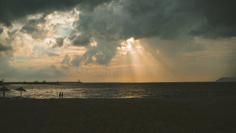 Majestic Wavy Sea Under a Dramatic Heavy Cloudscape with Bright Sun ...