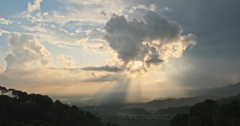The Majesty of Sunrays Piercing through Dramatic Clouds Stock Footage ...