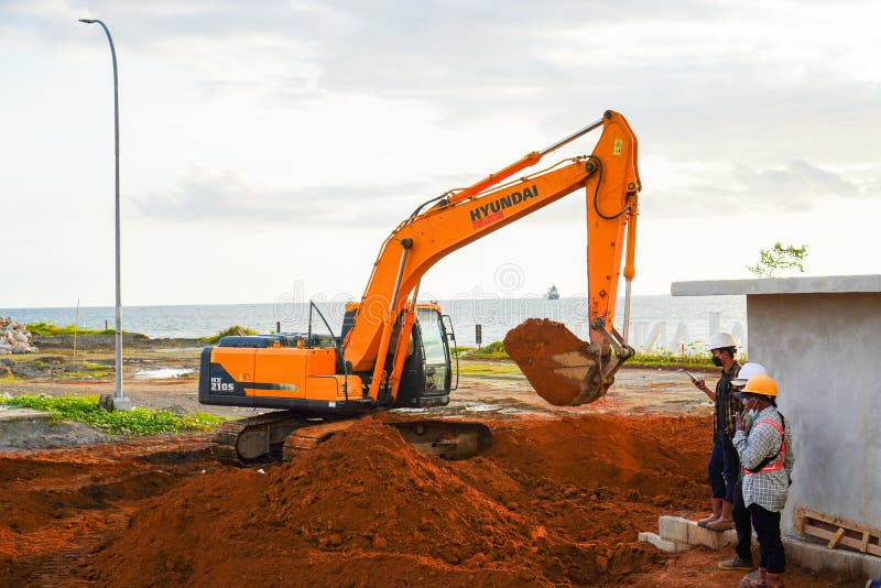 Makassar - June 10, 2022: Excavator Operator Digging the Ground in the ...