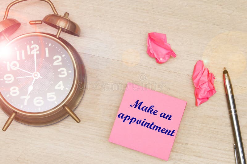 Make an Appointment on Pink Sticky Note on Office Table with Alarm ...