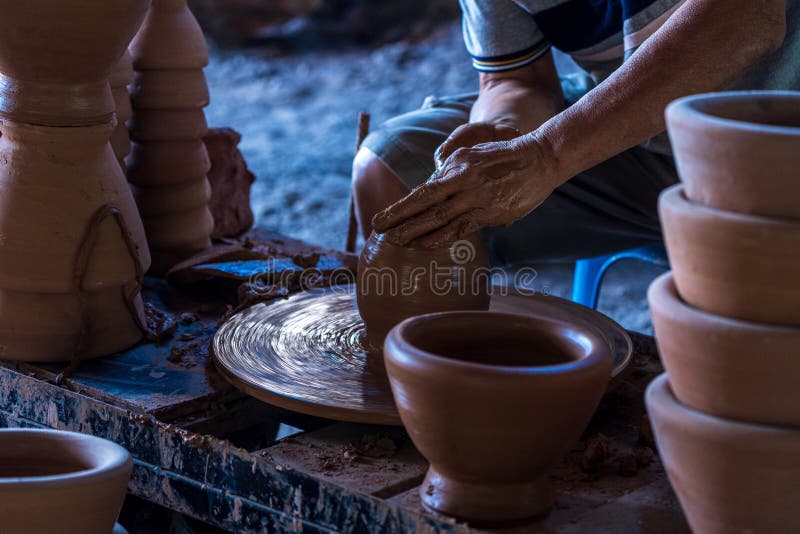 Make a Clay Mortar Thai. Hands of a Potter at Work Stock Photo - Image ...