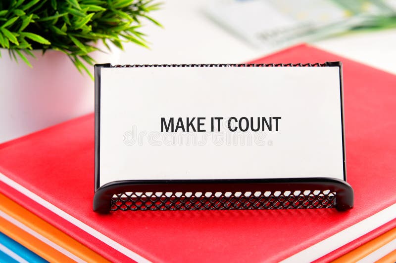 MAKE it COUNT Words Written on a White Business Card in a Stand on a ...