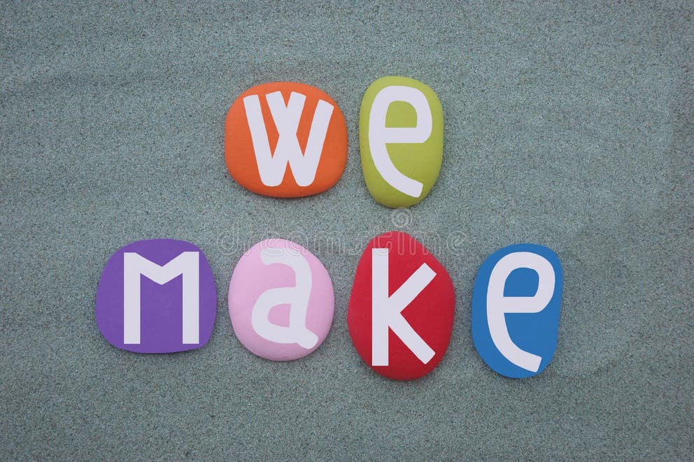 We Make, Creative Slogan Composed with Multi Colored Stone Letters Over ...