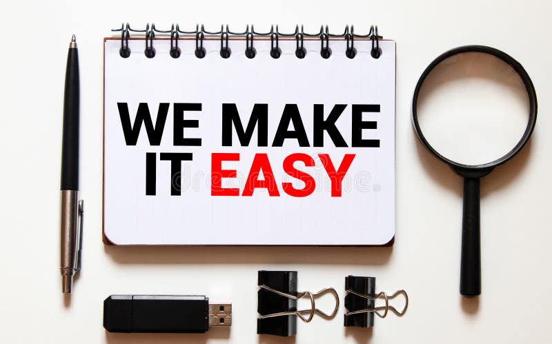 We Make it Easy Text in the Notebook on a Wooden Table. Top View ...