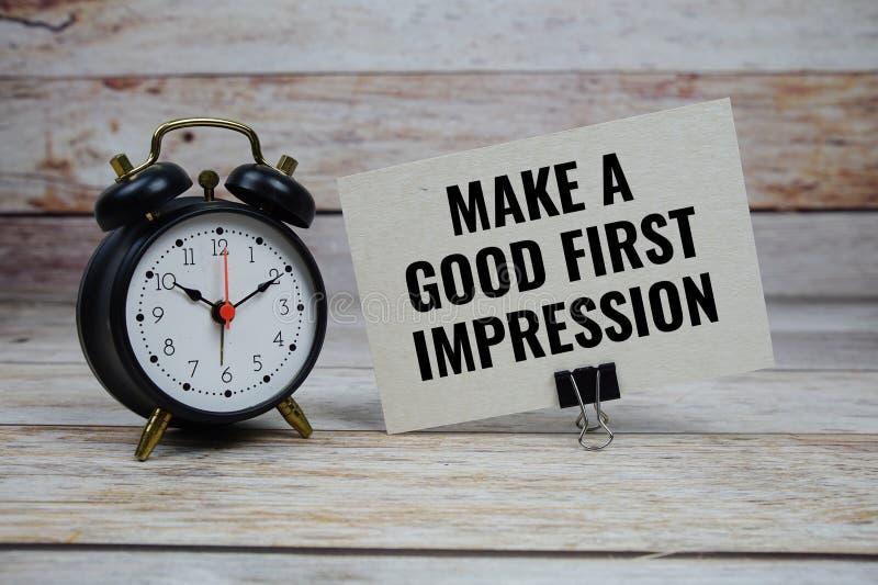 Make a Good First Impression Text on Paper Card with Alarm Clock on ...